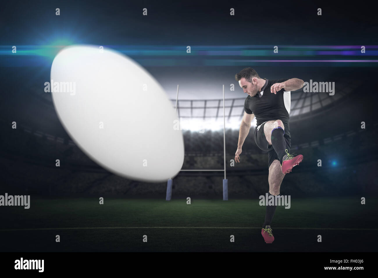 Composite image of rugby player kicking Stock Photo - Alamy