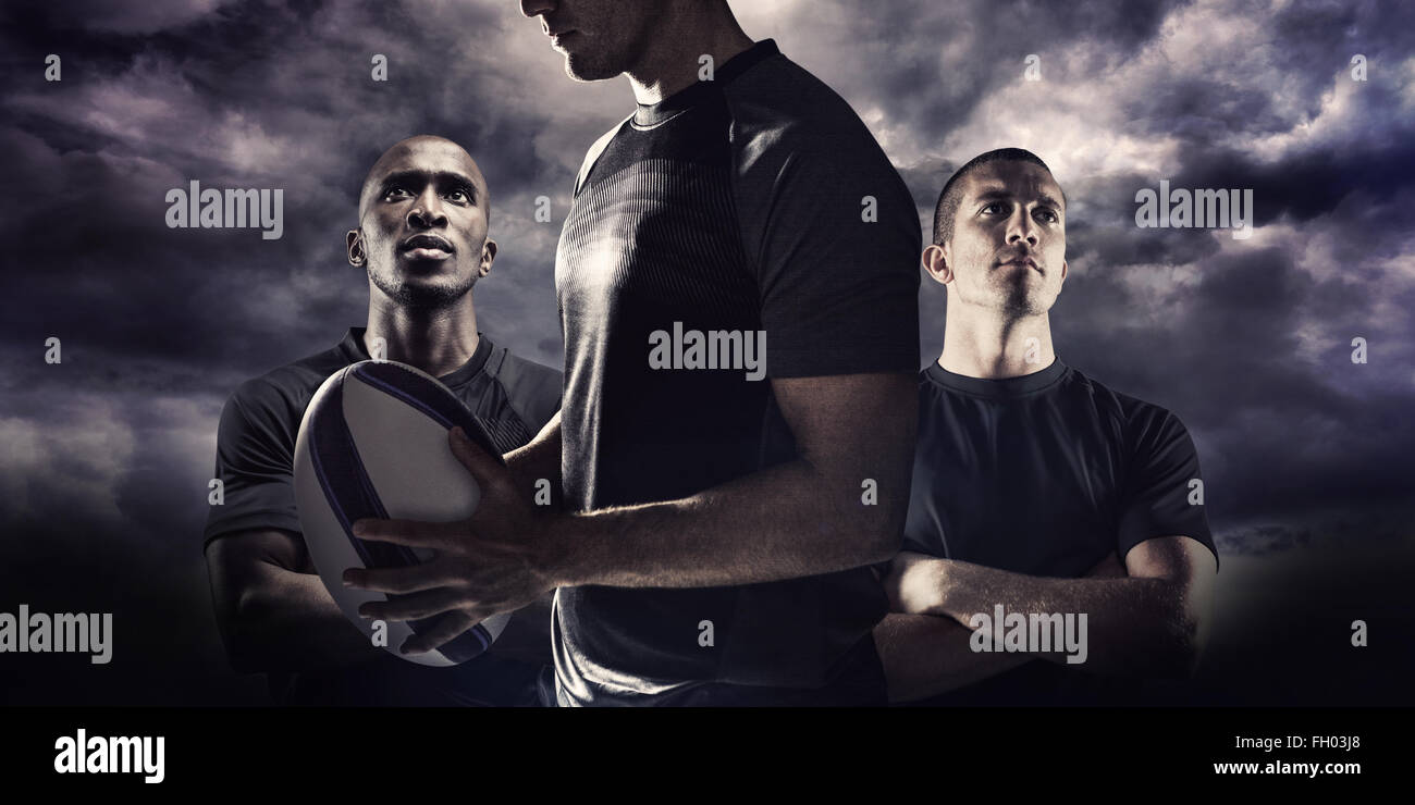 Composite image of calm rugby player thinking while holding ball Stock ...
