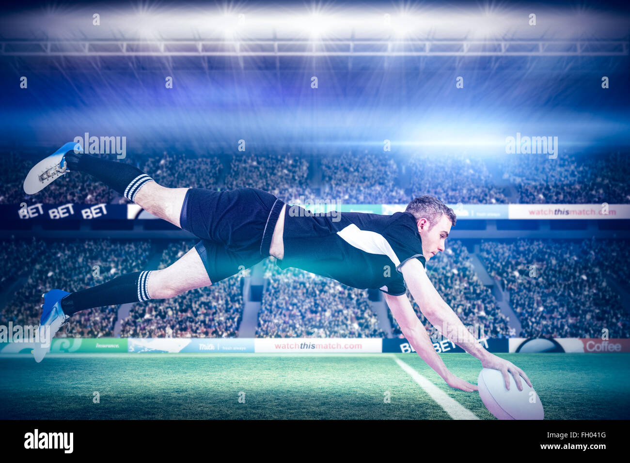 Composite image of a rugby player scoring a try Stock Photo - Alamy