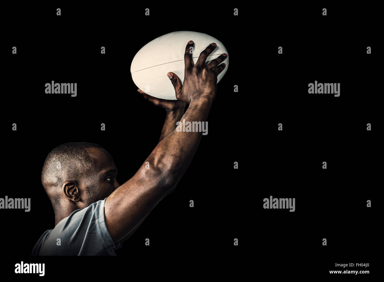 Composite image of athlete throwing rugby ball Stock Photo - Alamy