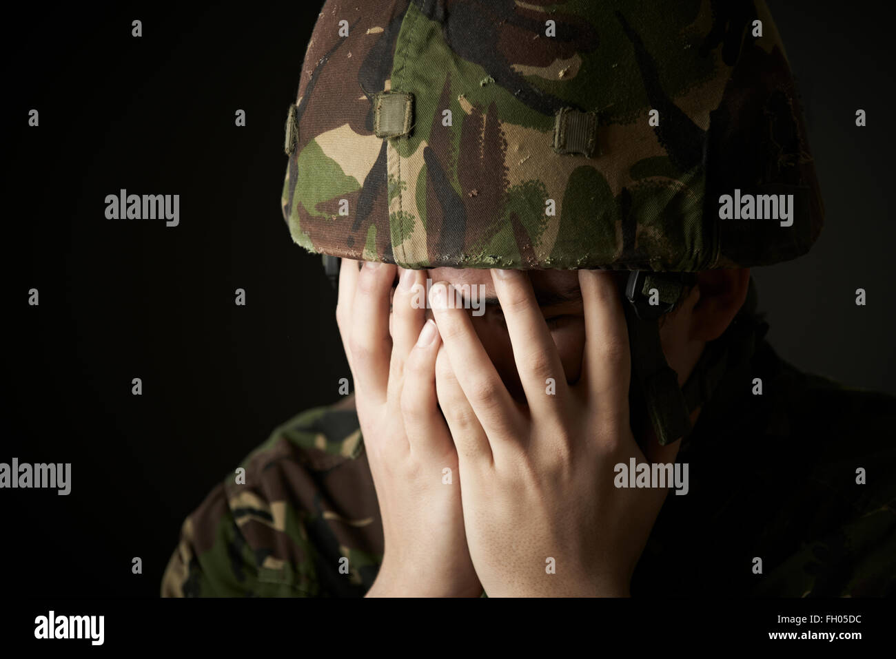 Soldier In Uniform Suffering From Stress Stock Photo - Alamy