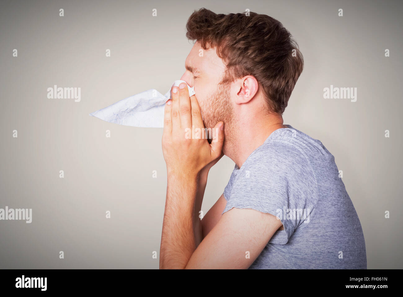 Composite image of close up side view of man blowing nose Stock Photo ...