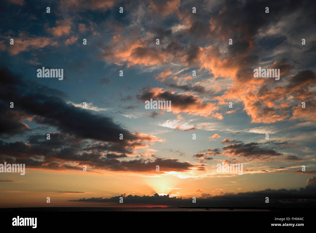 Cloudy sky with sunset and sunrays Stock Photo - Alamy