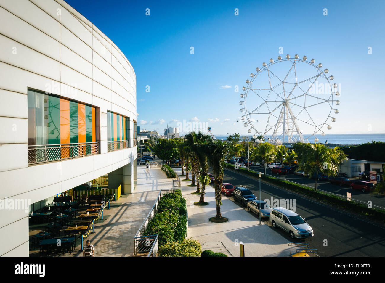 The exterior of the Mall of Asia and ferris wheel, in Pasay, Metro ...