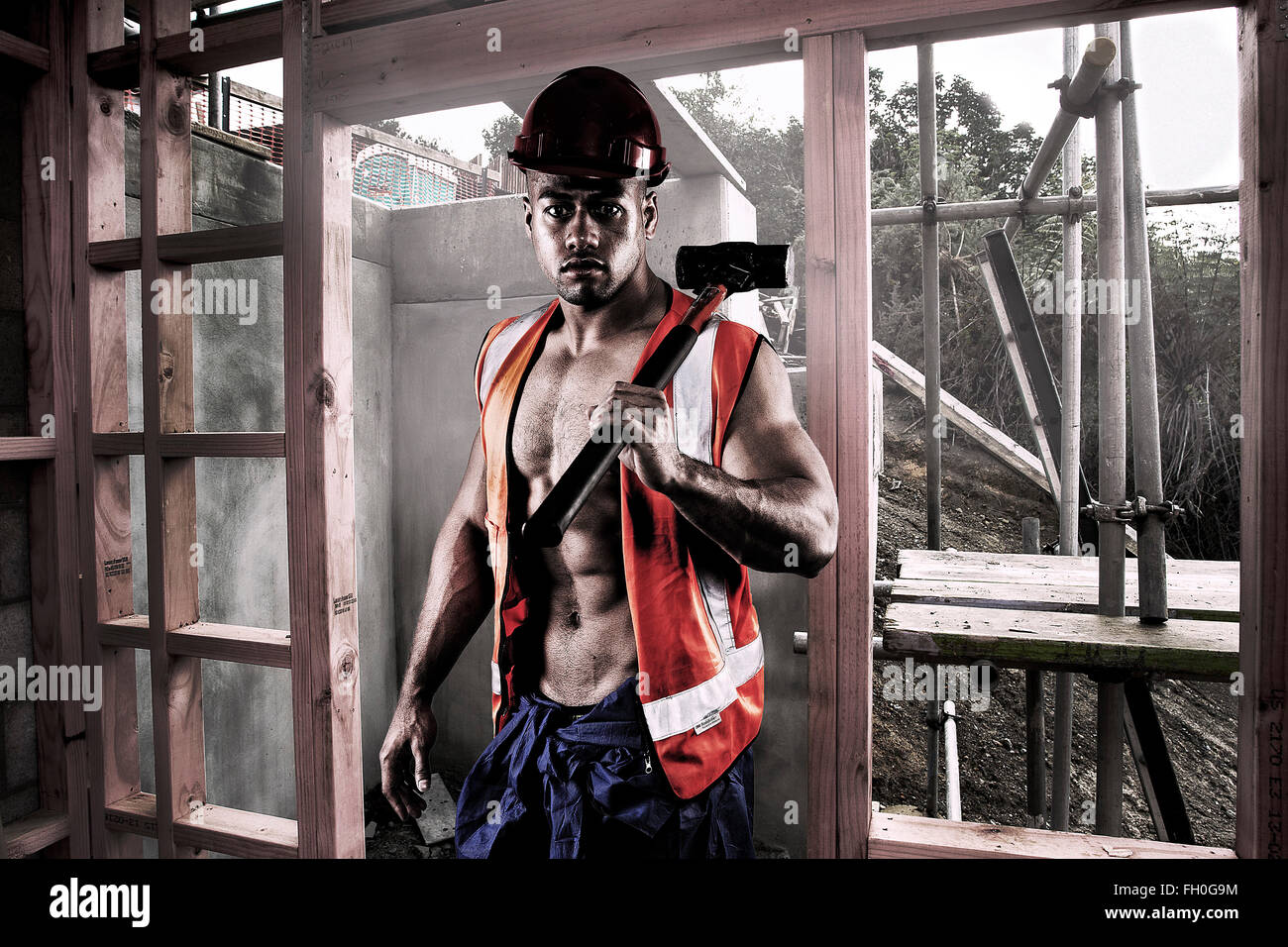 Male builder on construction site Stock Photo - Alamy