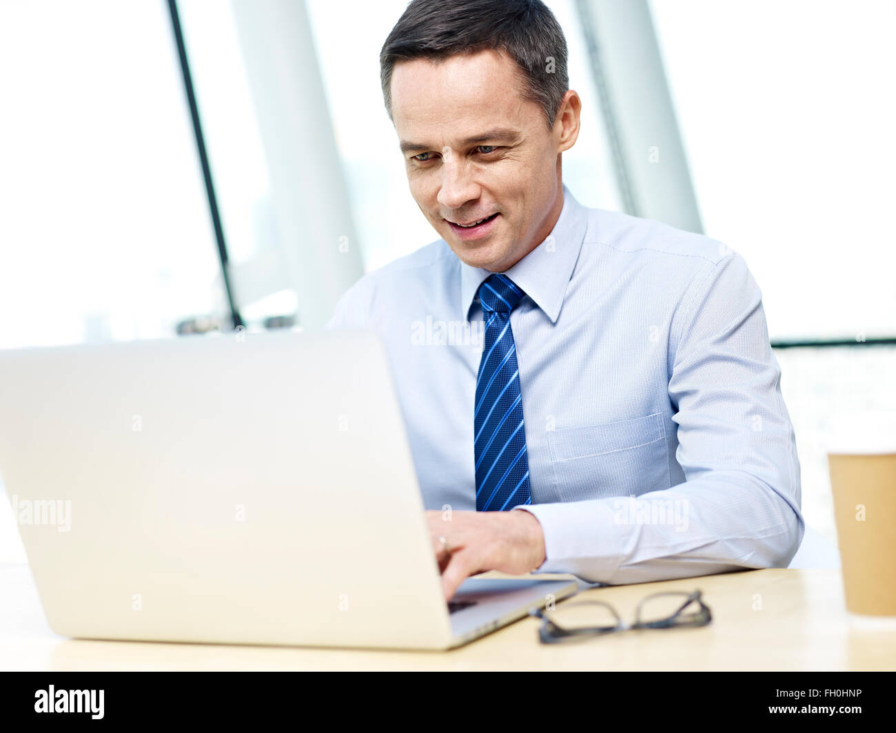 business person working on laptop Stock Photo - Alamy