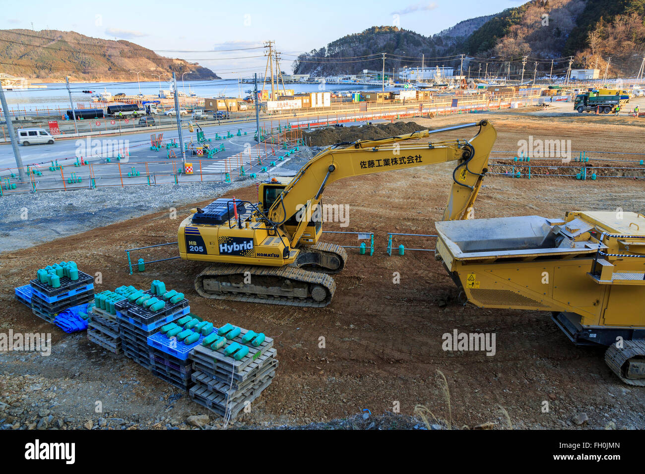 Construction trucks and bulldozers still work on the damaged zones by ...