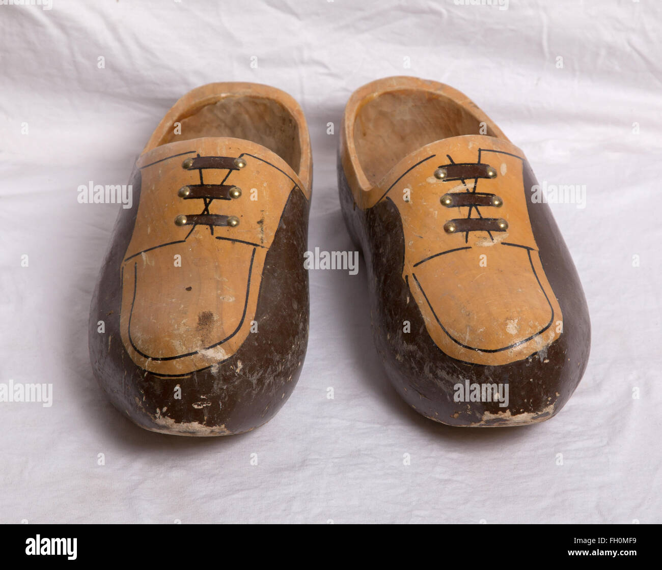 Pair of traditional Dutch wooden shoes on a white sheet Stock Photo - Alamy