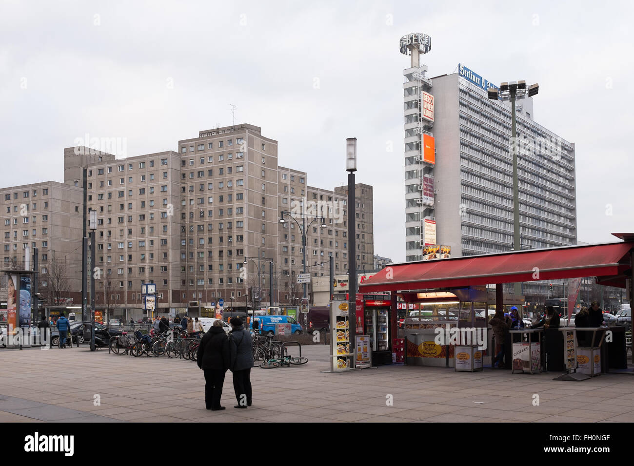 BERLIN, FEBRUARY 22: Couple observes GDR buildings in Alexanderplatz in ...