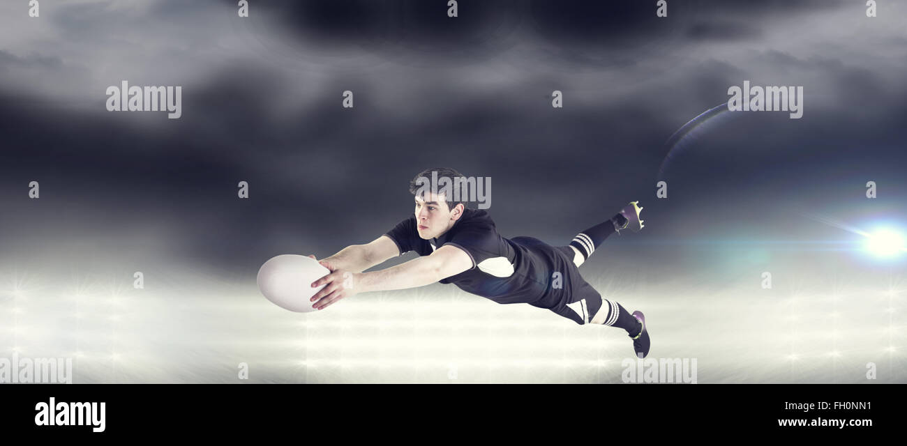 Composite image of a rugby player scoring a try Stock Photo - Alamy