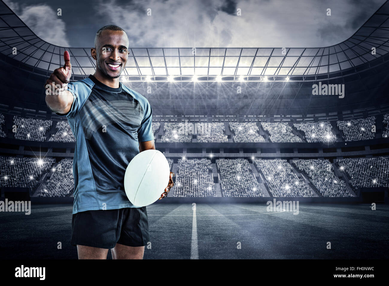 Composite image of portrait of confident rugby player smiling and ...