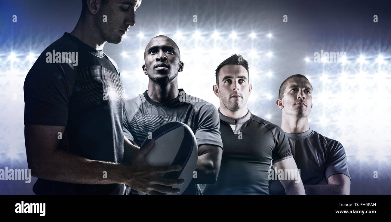 Composite image of calm rugby player thinking while holding ball Stock ...