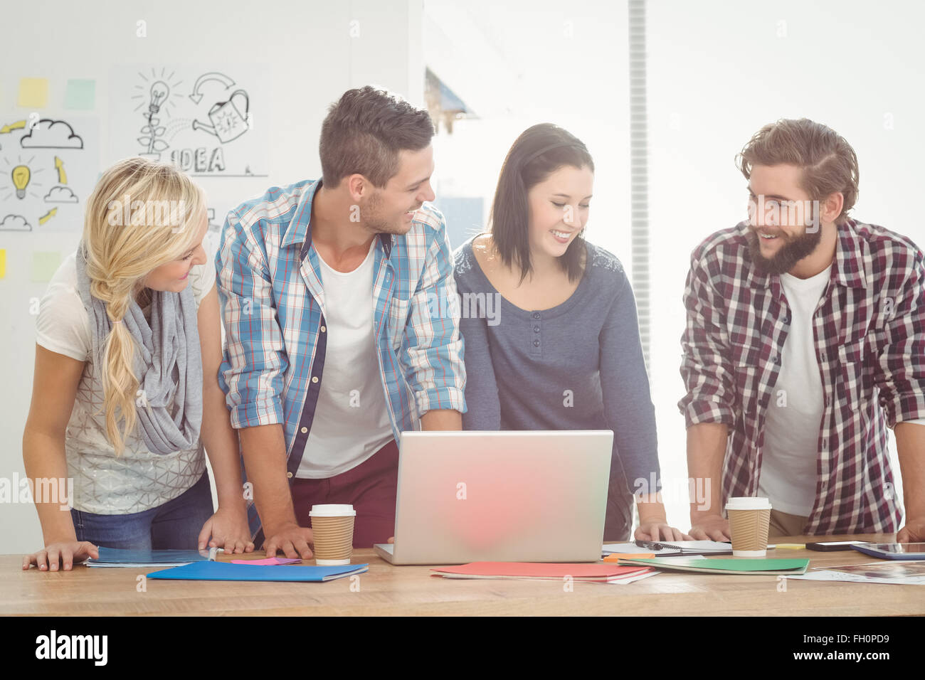 Smiling business people bending Stock Photo - Alamy