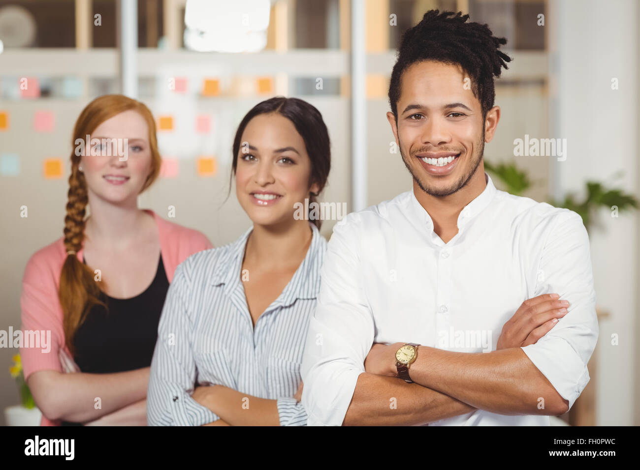 Confident colleagues at office Stock Photo - Alamy