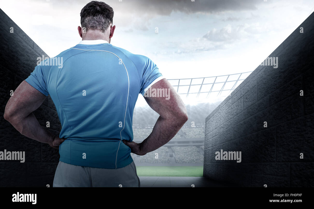 Composite image of rugby player with hands on hips Stock Photo - Alamy