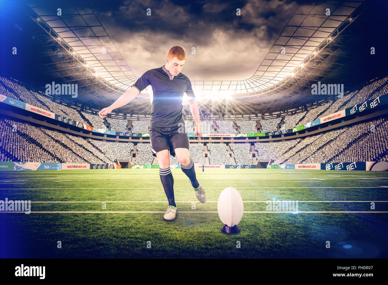 Composite image of rugby player doing a drop kick Stock Photo - Alamy