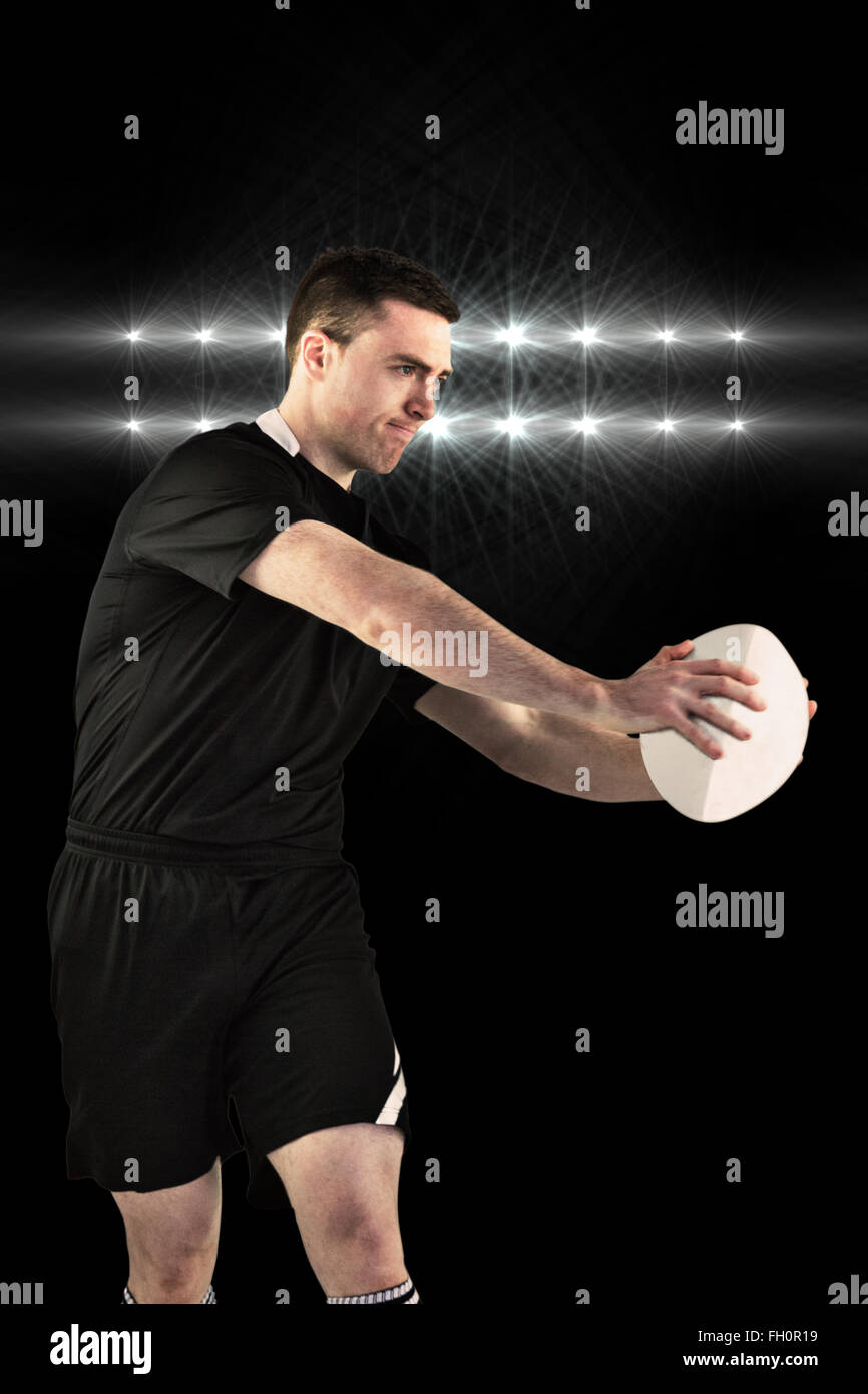 Composite image of rugby player about to throw a rugby ball Stock Photo ...