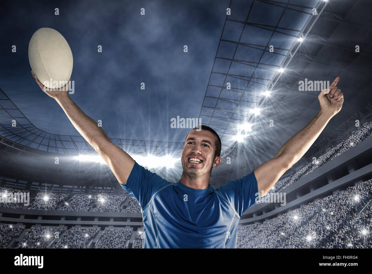 Composite image of happy rugby player in blue jersey holding ball with ...