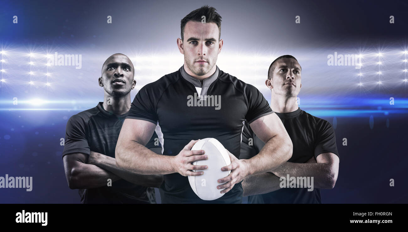 Composite image of tough rugby player looking at camera Stock Photo - Alamy