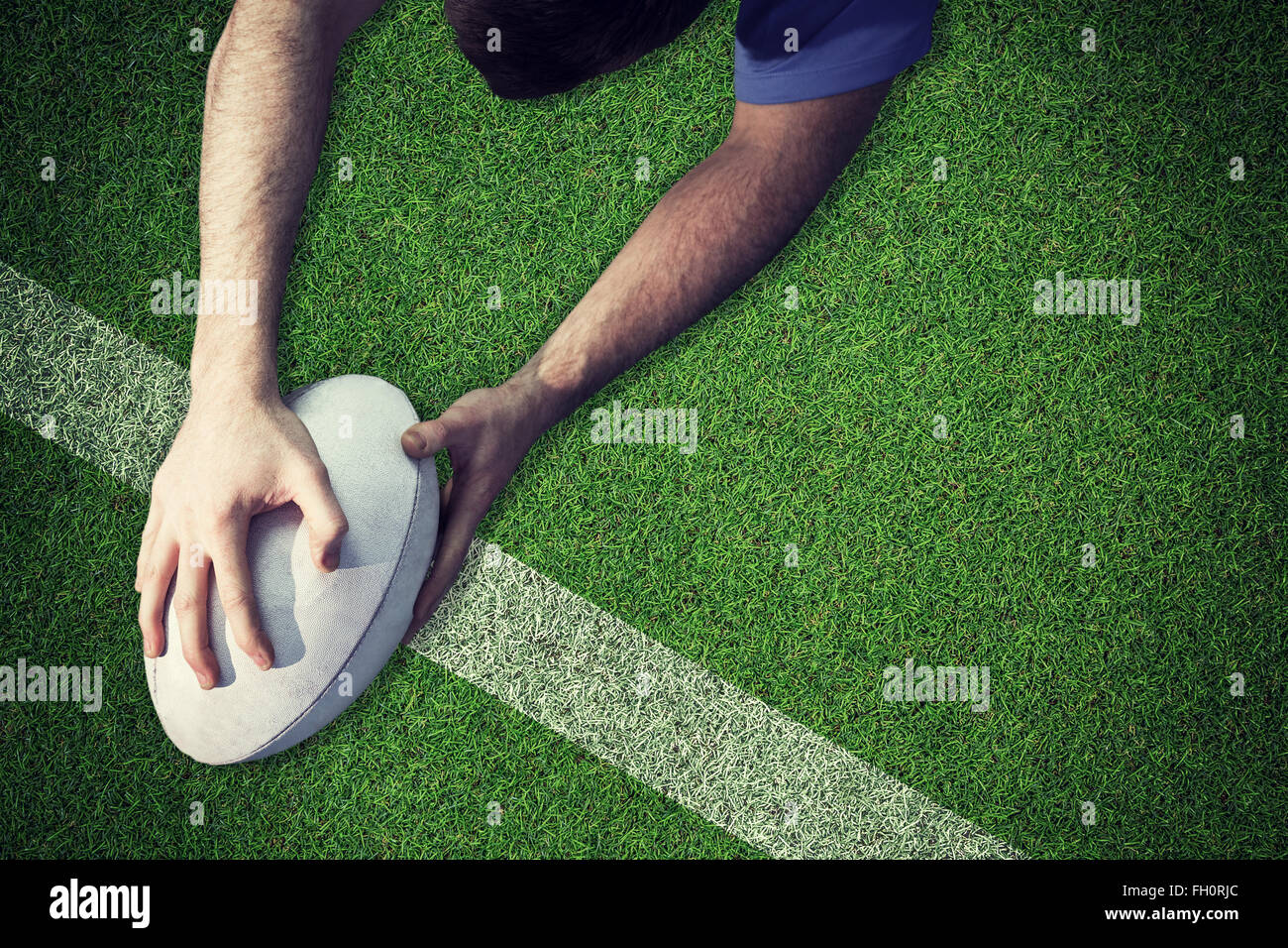 Composite image of a rugby player scoring a try Stock Photo - Alamy