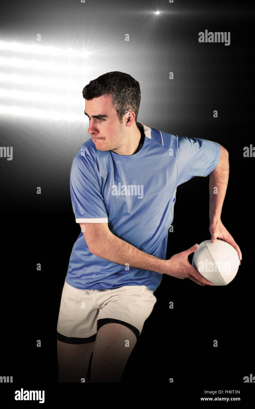 Composite image of rugby player doing a side pass Stock Photo - Alamy