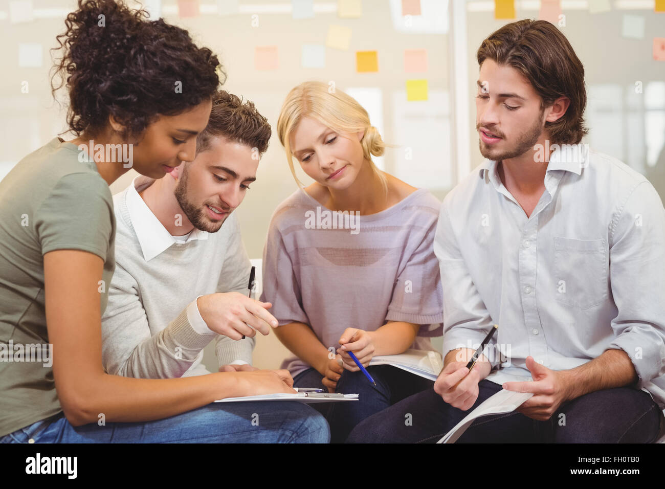 Colleagues interacting with each other Stock Photo - Alamy