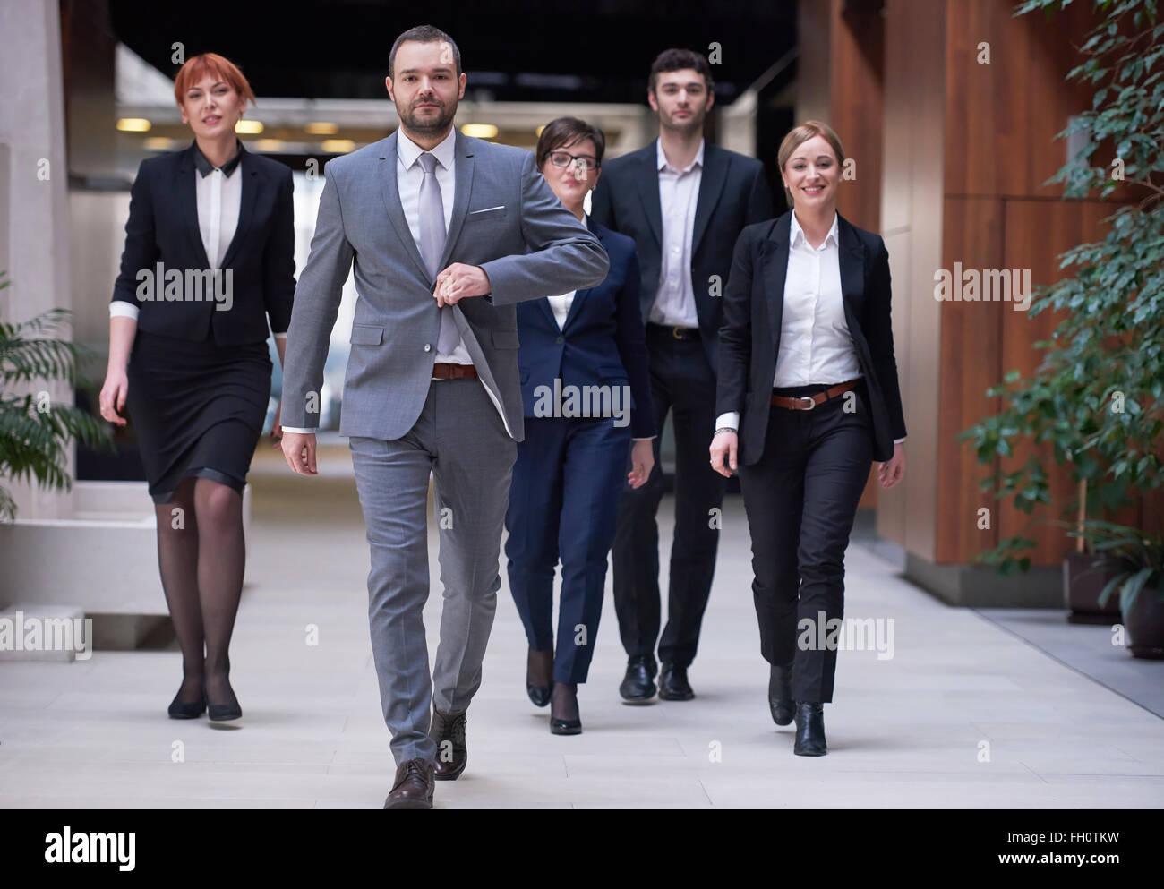 business people team walking Stock Photo - Alamy