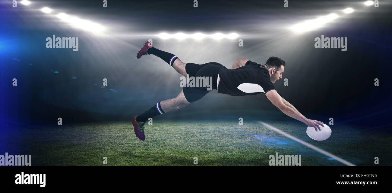 Composite image of rugby player scoring a try Stock Photo - Alamy