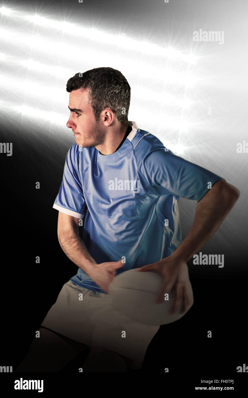 Composite image of rugby player doing a side pass Stock Photo - Alamy