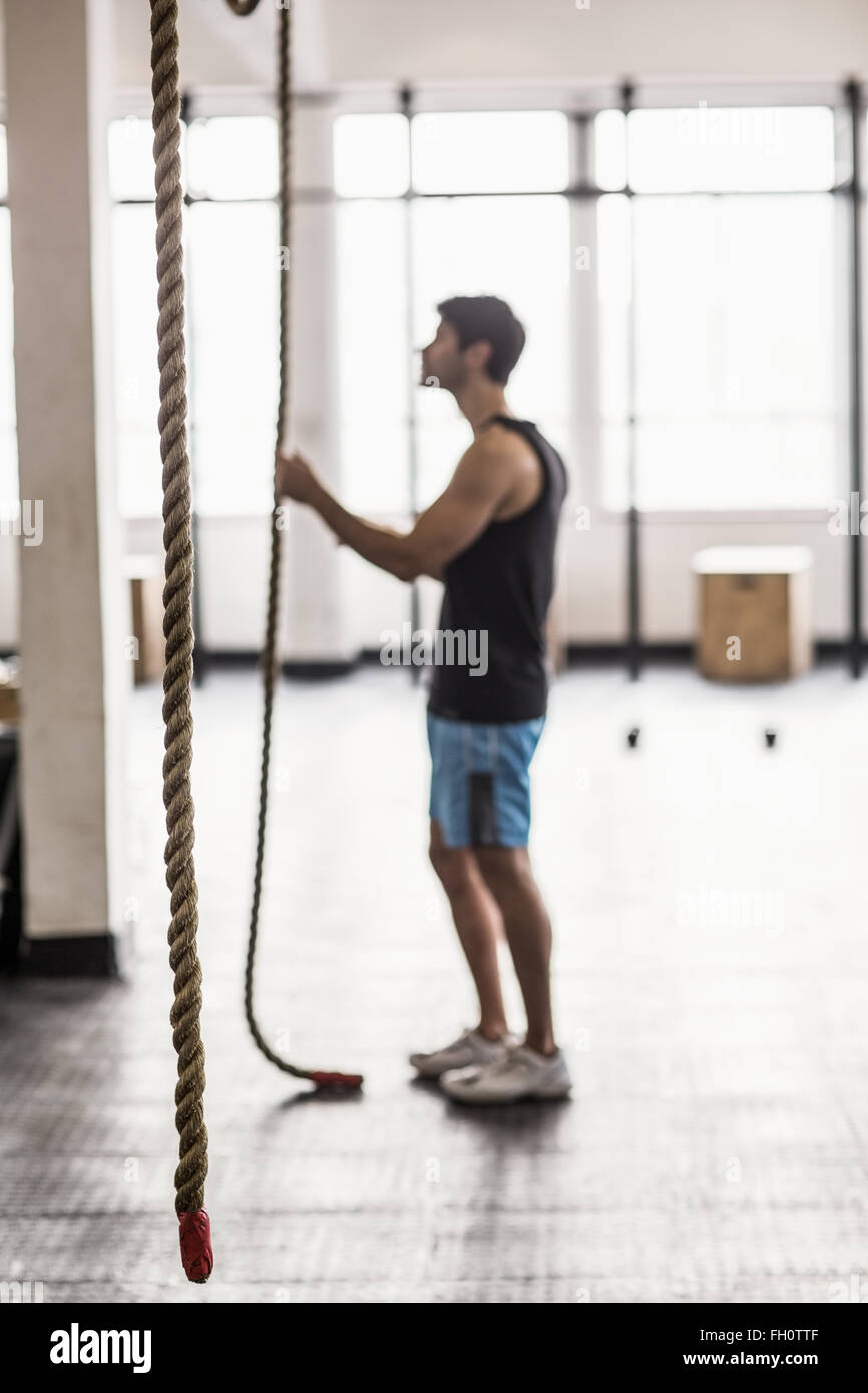 Young bodybuilder holding the ropes Stock Photo - Alamy