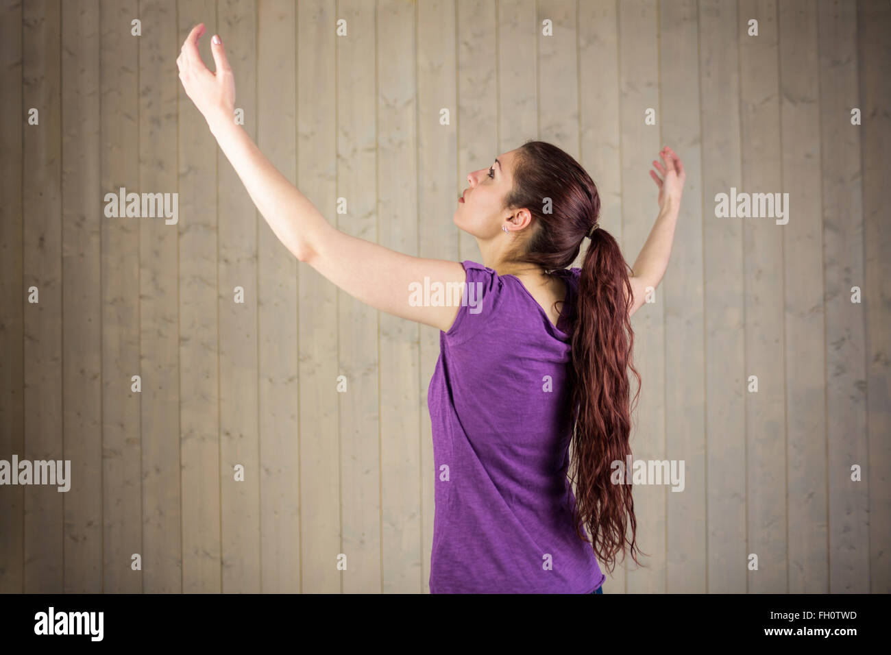 Woman with arms raised Stock Photo - Alamy