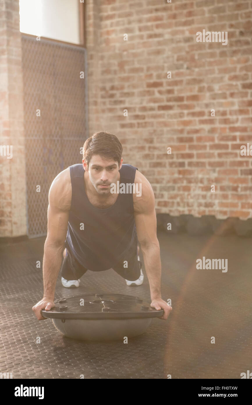Man doing bosu push ups Stock Photo - Alamy