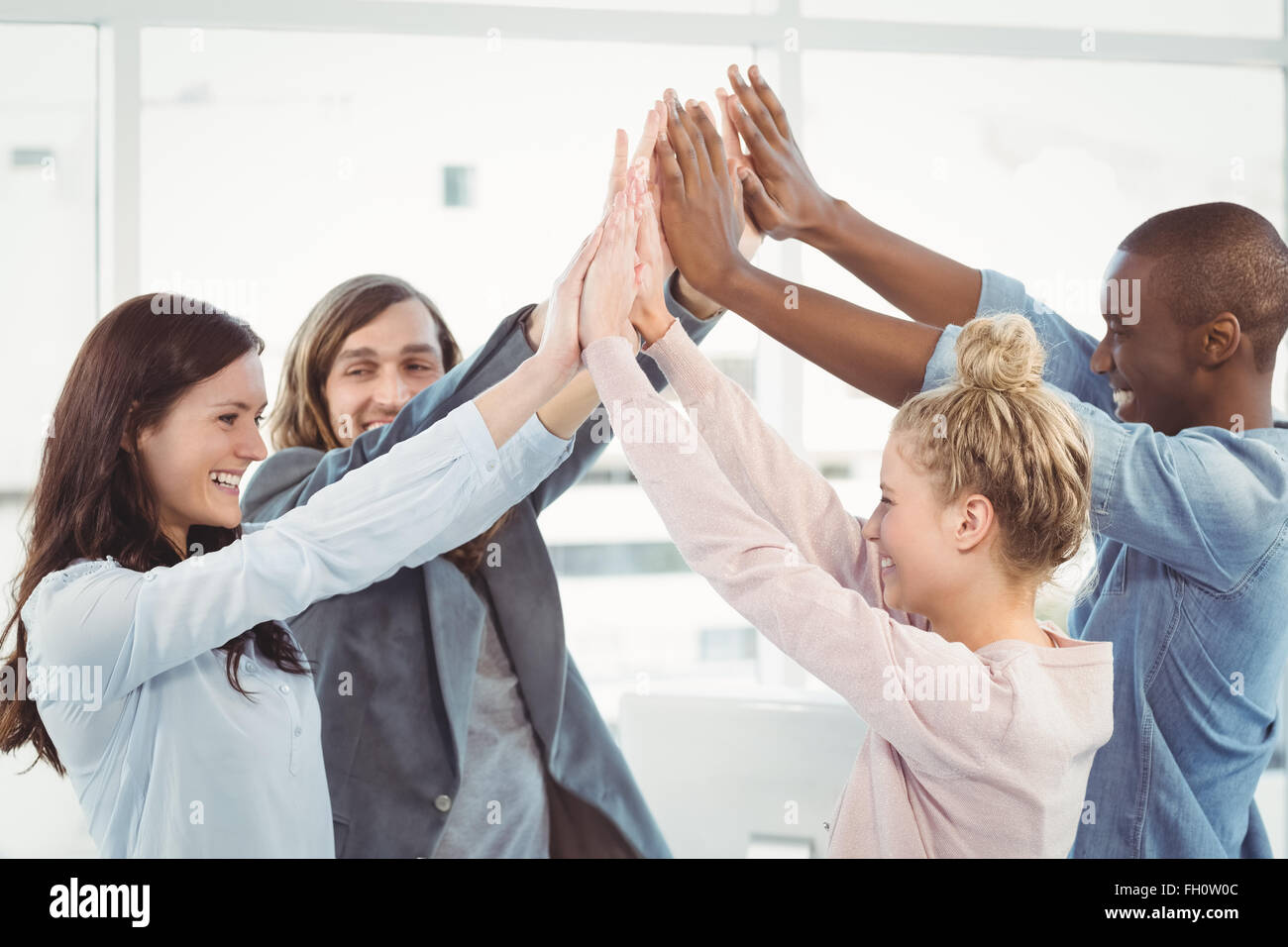 Cheerful creative business team high hi-res stock photography and ...