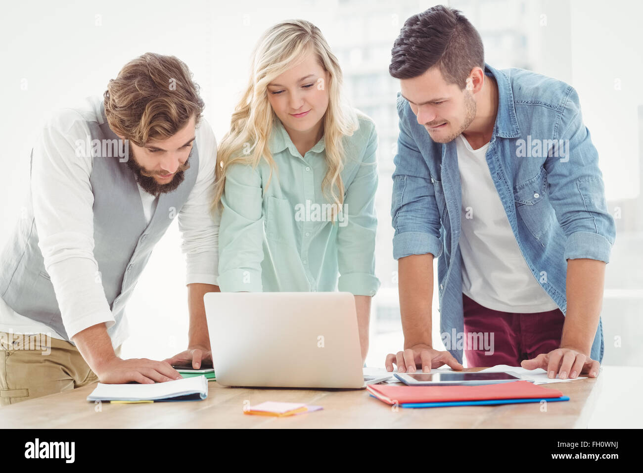 Smiling business professionals working Stock Photo - Alamy