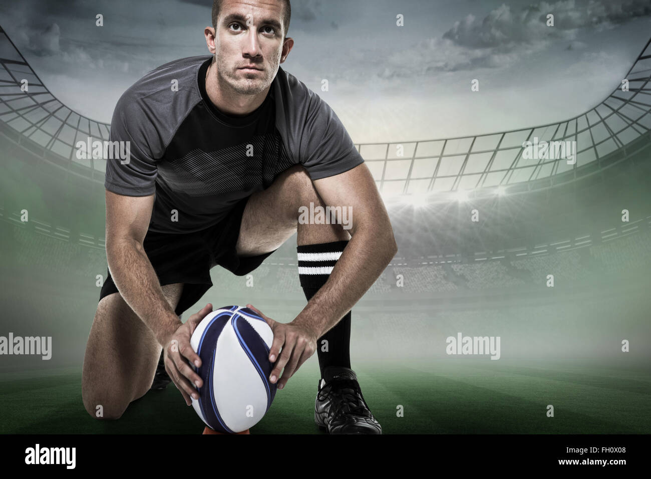 Composite image of portrait of rugby player in black jersey placing ...