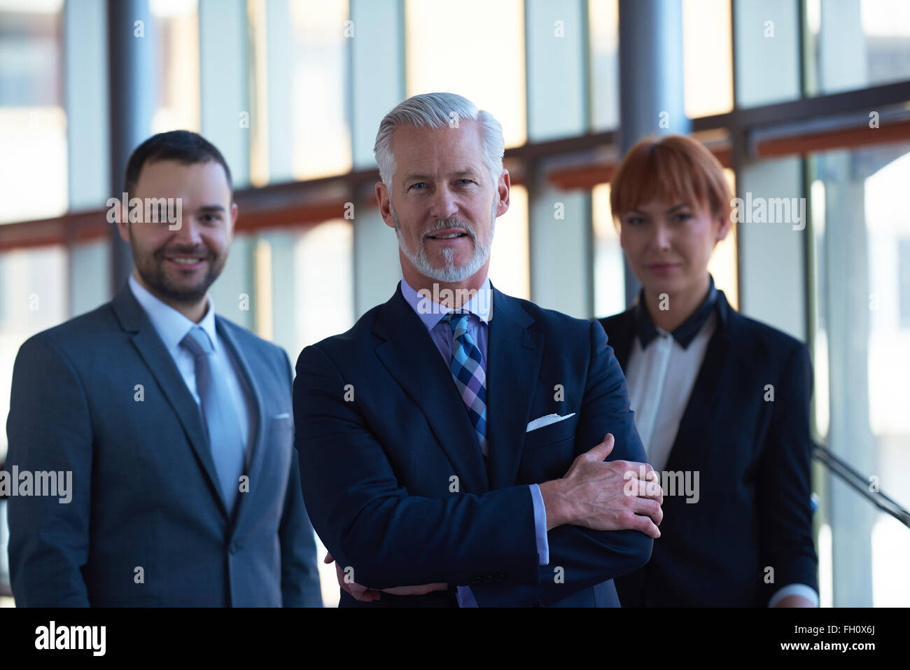 senior business man with his team at office Stock Photo - Alamy