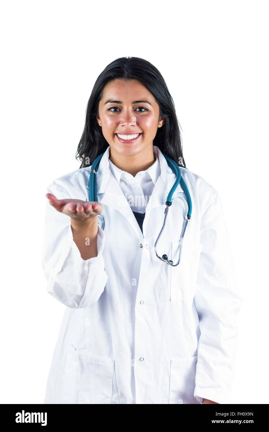 Smiling doctor holding her hand out Stock Photo - Alamy