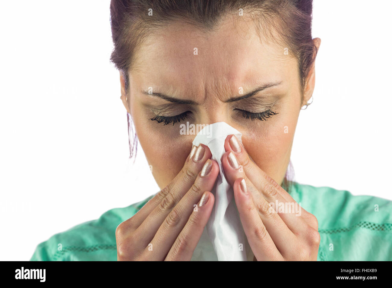 Close-up of woman suffering from cold with tissue on mouth Stock Photo ...