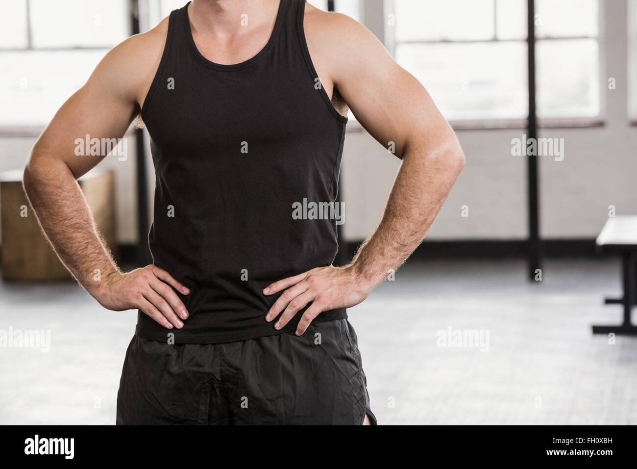 Midsection of man with hands on hip Stock Photo - Alamy