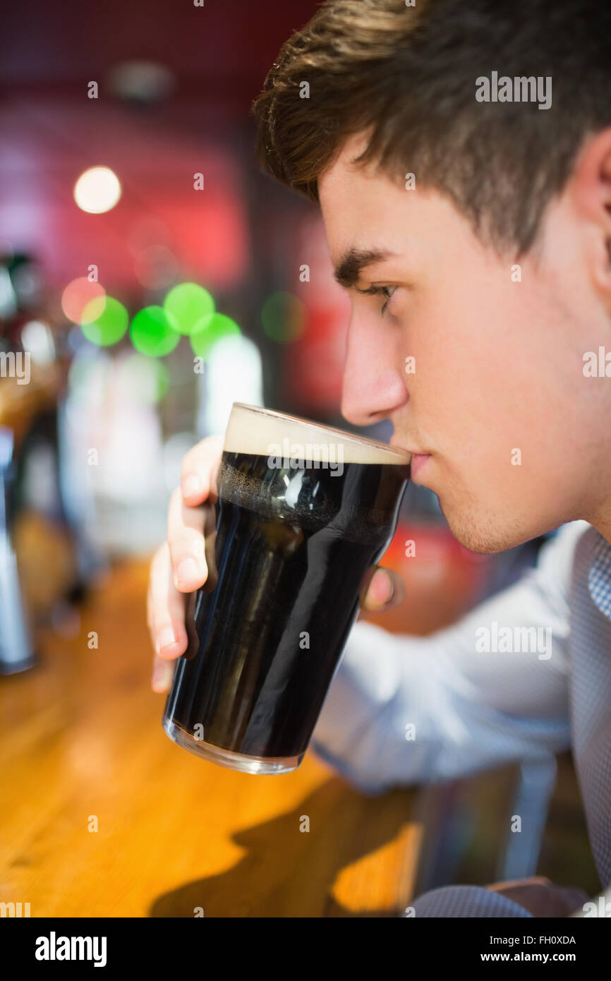 Man with drinking at bar counter Stock Photo - Alamy