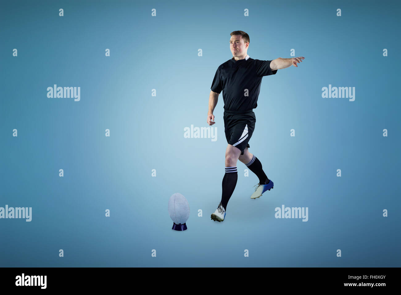 Composite image of rugby player doing a drop kick Stock Photo - Alamy