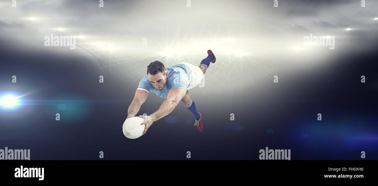 Composite image of rugby player scoring a try Stock Photo - Alamy