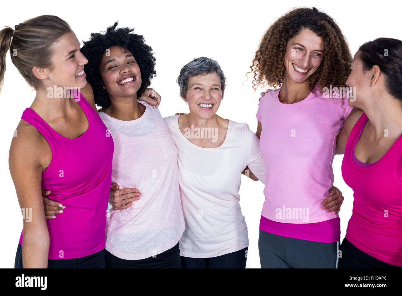 Smiling women with arms around Stock Photo - Alamy