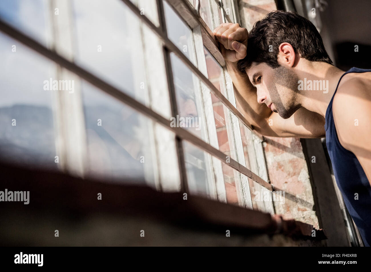 Man looking outside from window Stock Photo - Alamy