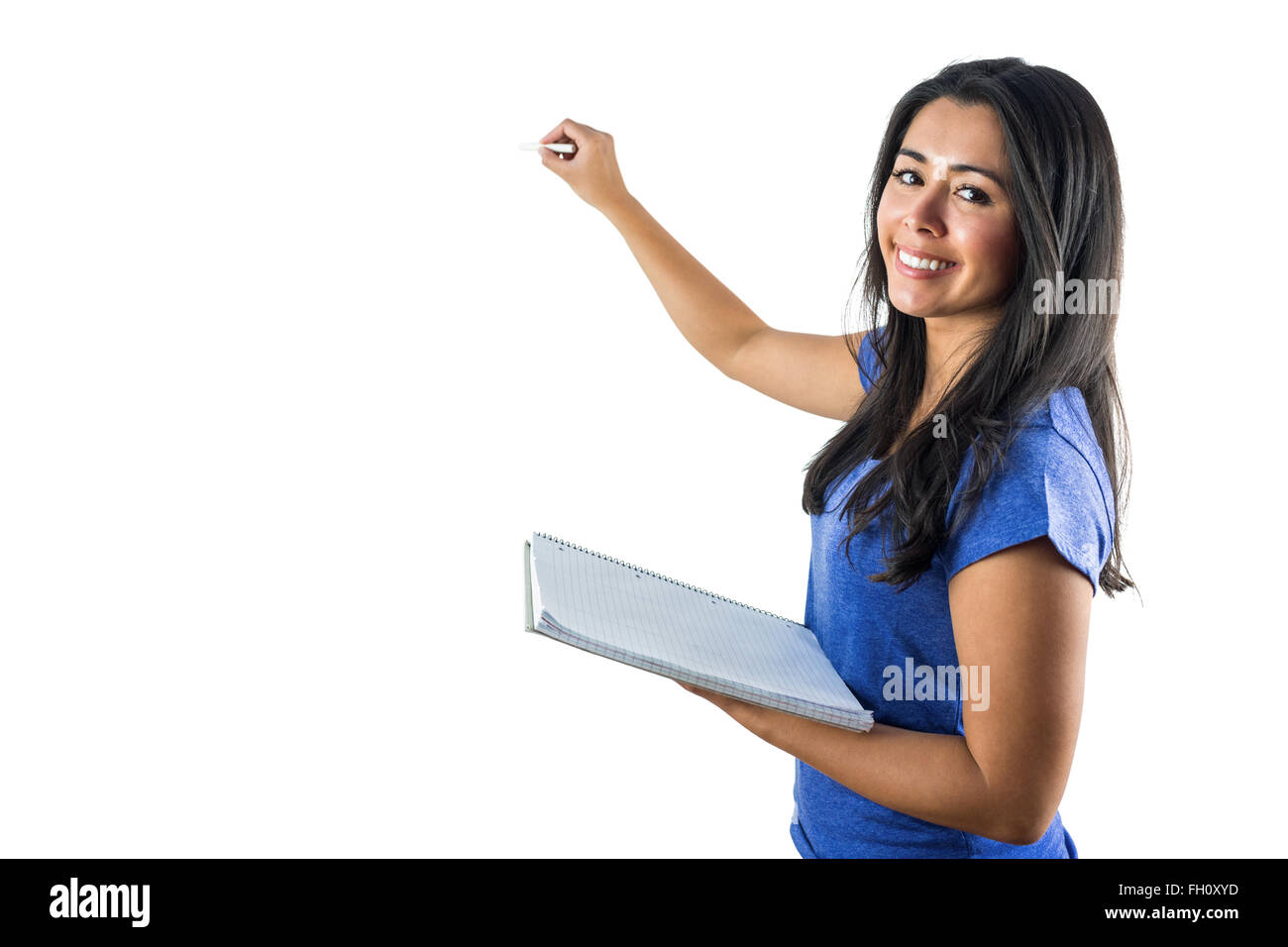 Smiling woman about to write something Stock Photo - Alamy