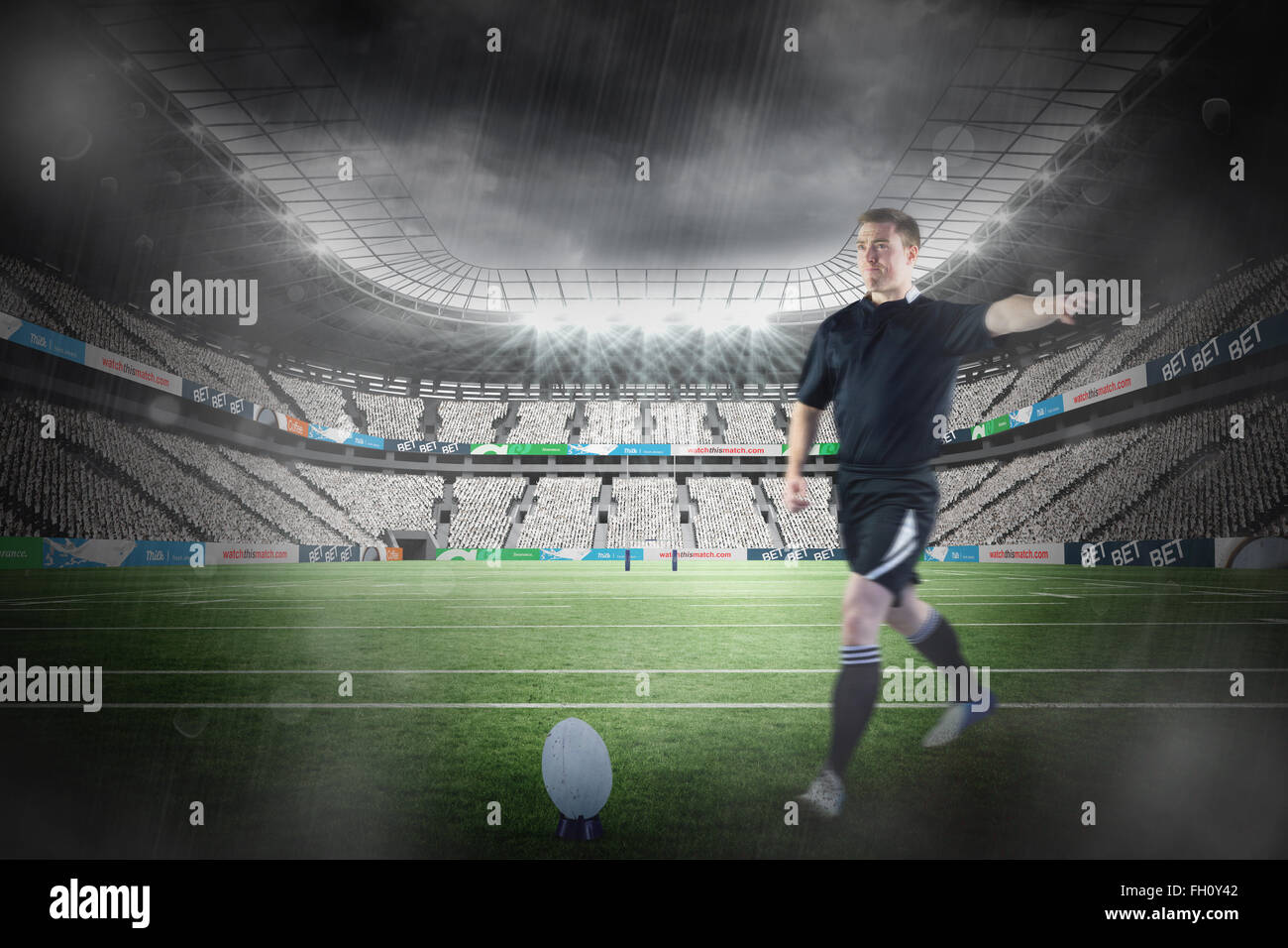 Composite image of rugby player doing a drop kick Stock Photo - Alamy