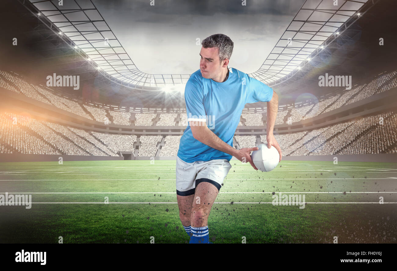 Composite image of rugby player doing a side pass Stock Photo - Alamy