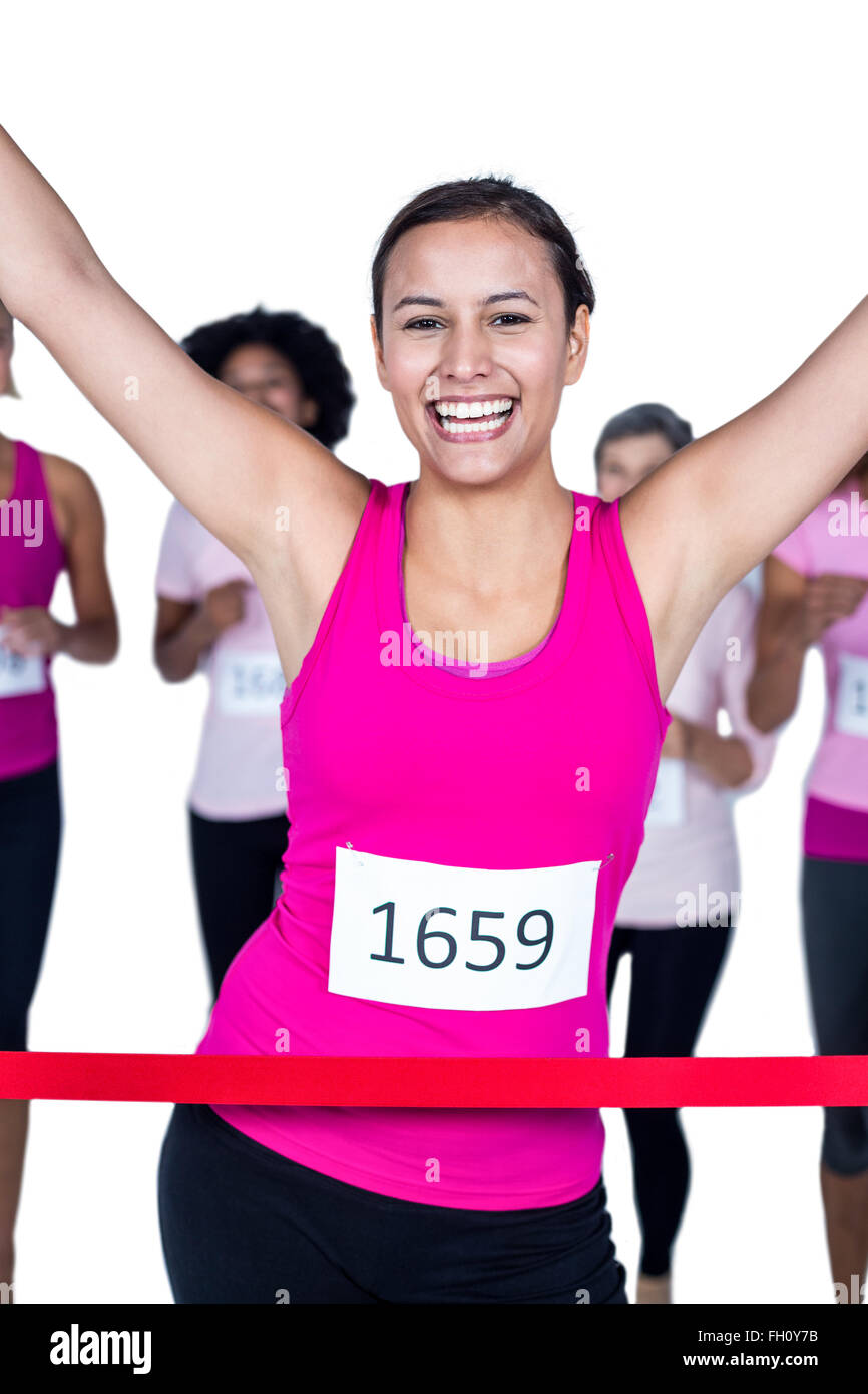 Portrait of cheerful winner athlete crossing finish line Stock Photo ...