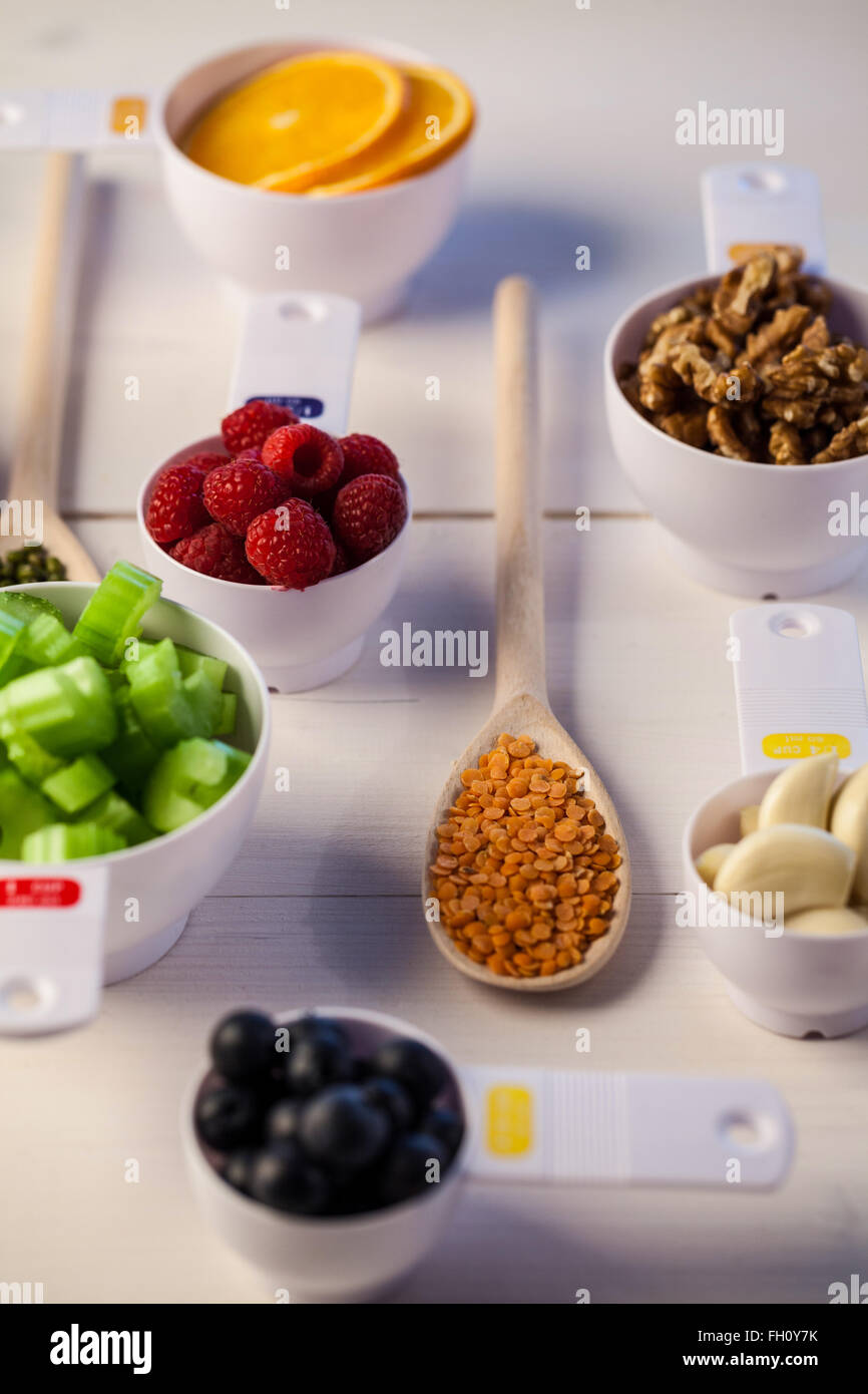 Portion cups of healthy ingredients Stock Photo - Alamy