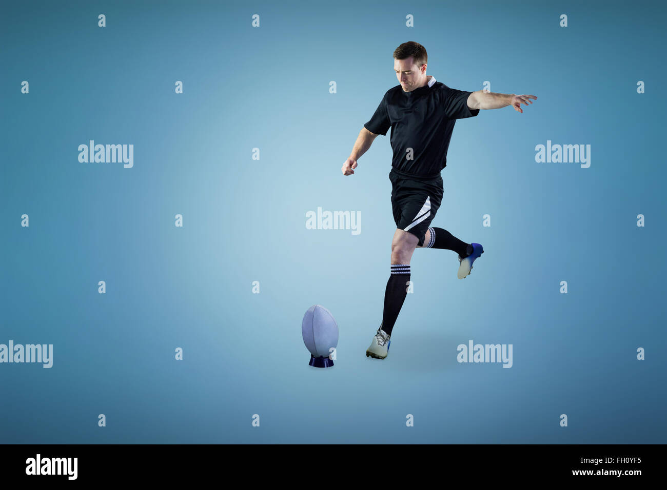 Composite image of rugby player doing a drop kick Stock Photo - Alamy